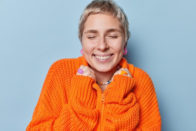 Premium Photo | Cheerful short haired woman keeps eyes closed smiles ... Premium Photo | Cheerful short haired woman keeps eyes closed smiles ...