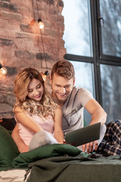 Premium Photo Chilling In Bed Beaming Just Married Happy Couple