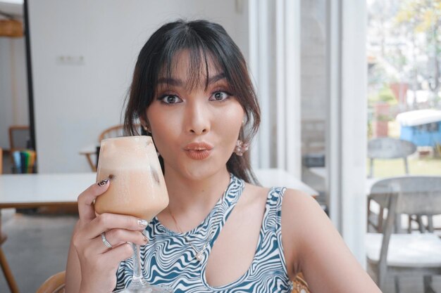 Premium Photo Close Up Girl Is Drinking Coffee She Has Coffee Foam On Her Lips And She Smiles