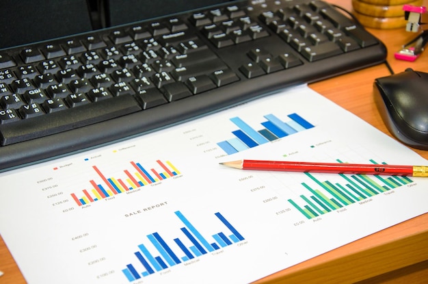 Premium Photo | Close-up of graphs on table in office Premium Photo | Close-up of graphs on table in office