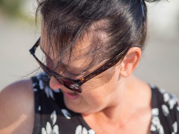 Premium Photo Close Up Of Mature Woman Wearing Sunglasses