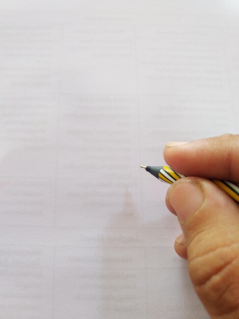 Premium Photo | Close-up of person hand holding pen Premium Photo | Close-up of person hand holding pen