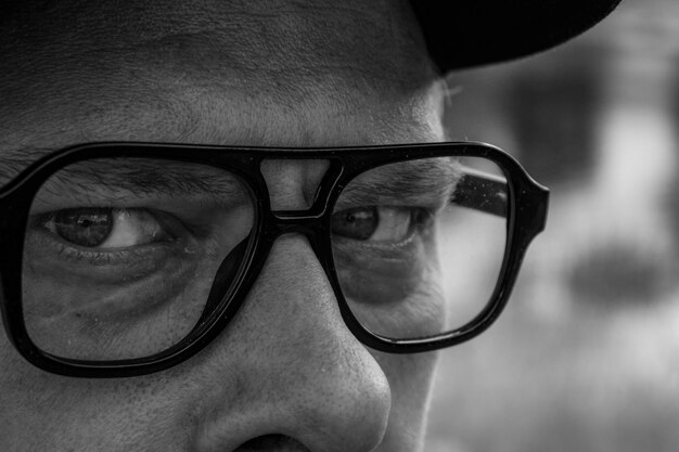Premium Photo Close Up Portrait Of Man Wearing Eyeglasses
