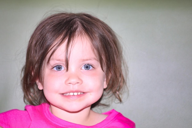 Premium Photo | Close-up portrait of smiling cute girl Premium Photo | Close-up portrait of smiling cute girl