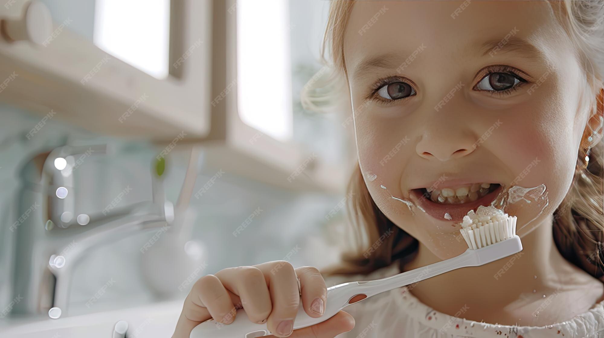 Premium Photo Closeup Of A Girl Brushing Her Teeth Selective Focus