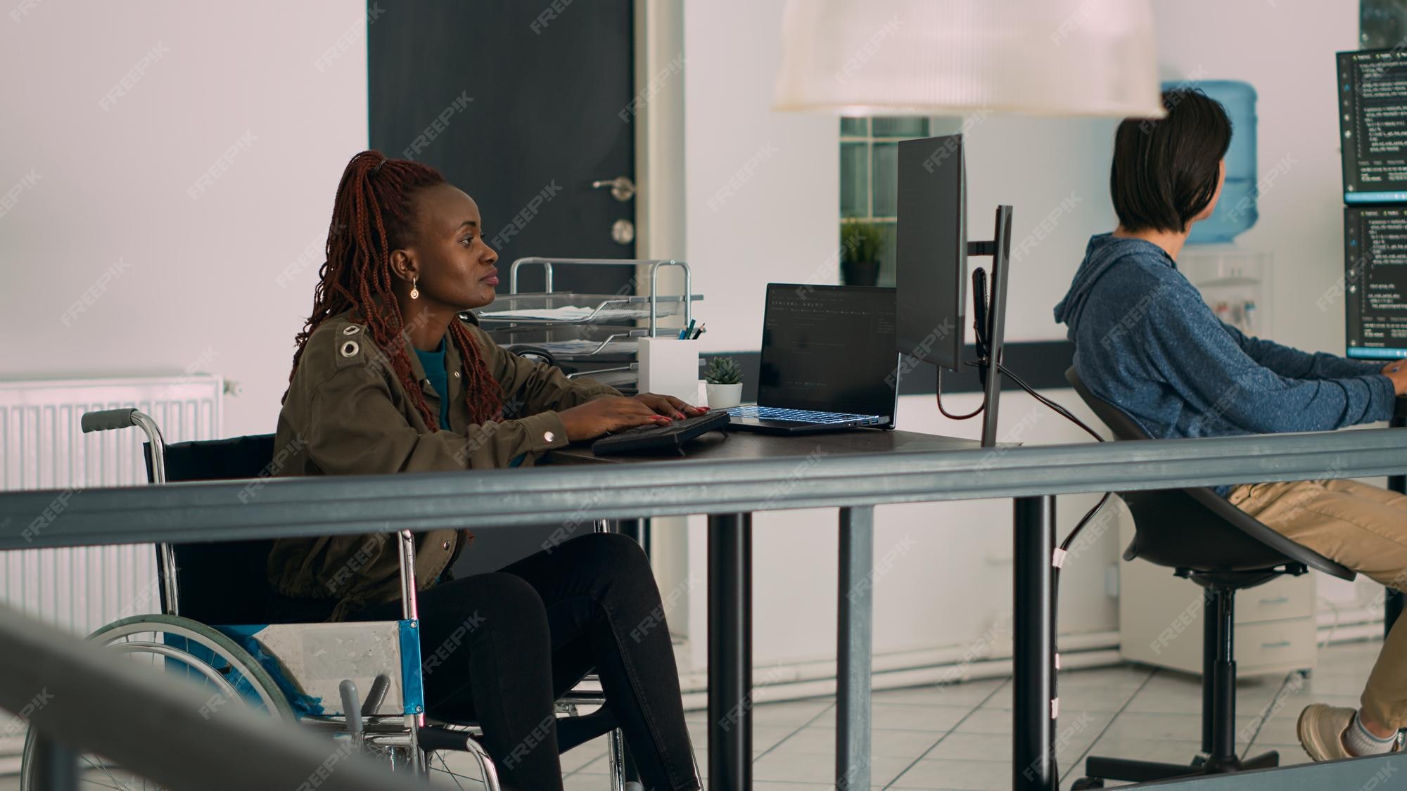 Premium Photo | Cloud programmer in wheelchair using server data to create software app on ...