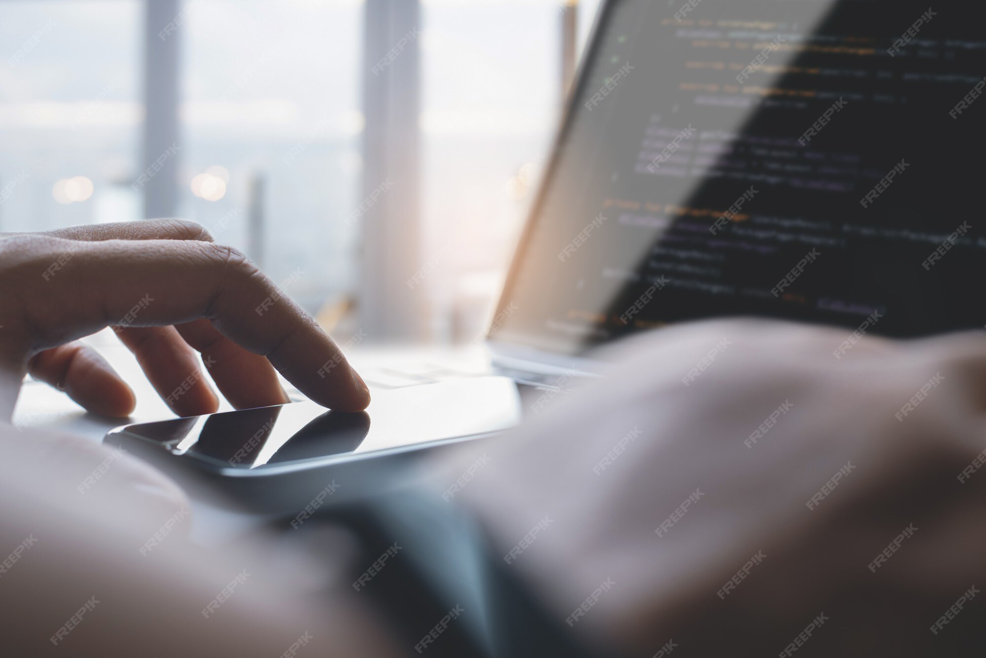 Premium Photo | Computer programmer mobile app developer using mobile ...