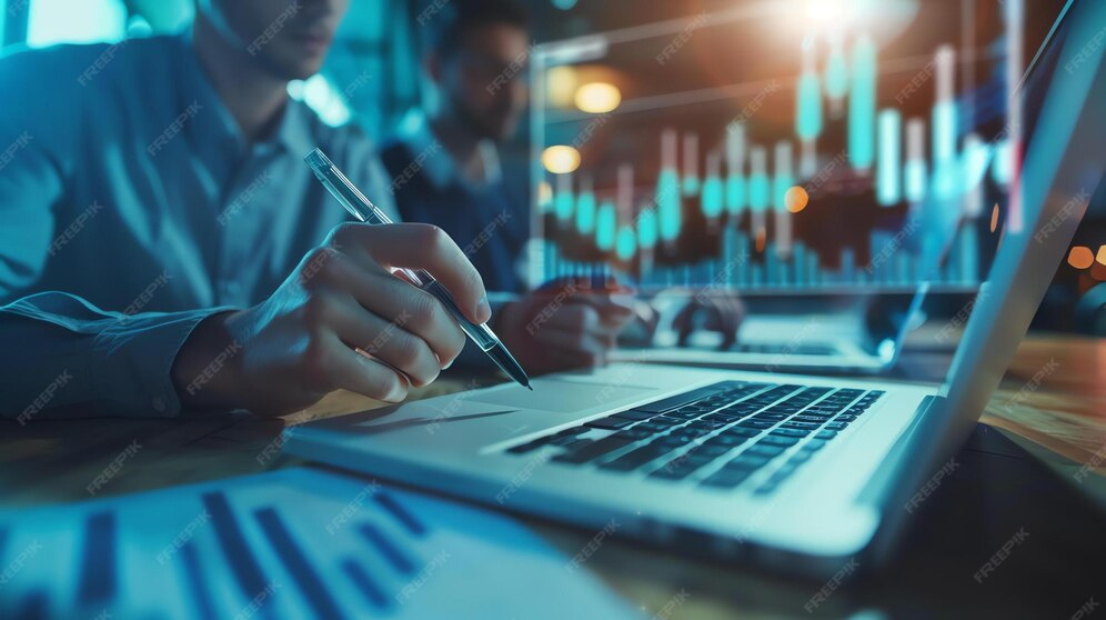Confident businessperson using laptop and analyzing graphs and charts ... Confident businessperson using laptop and analyzing graphs and charts ...