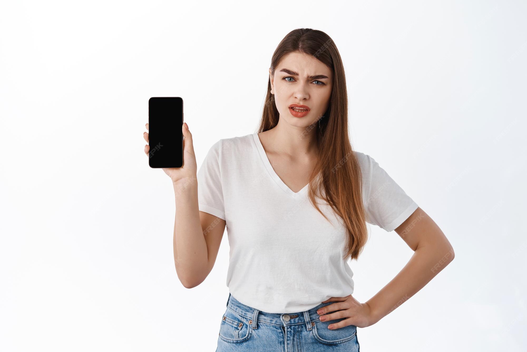 Premium Photo Confused Disappointed Woman Shows Empty Smartphone