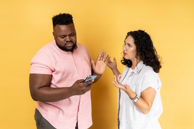 Premium Photo Couple Standing Together Man Using Cell Phone And