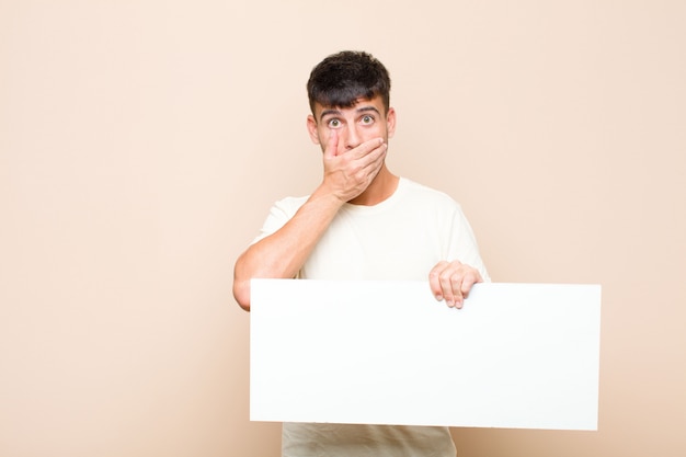 Premium Photo Covering Mouth With Hands With A Shocked Surprised