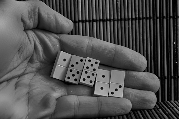 Premium Photo | Cropped hand holding dice Premium Photo | Cropped hand holding dice