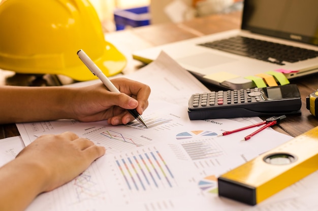 Premium Photo | Cropped hands of architect drawing blueprint Premium Photo | Cropped hands of architect drawing blueprint