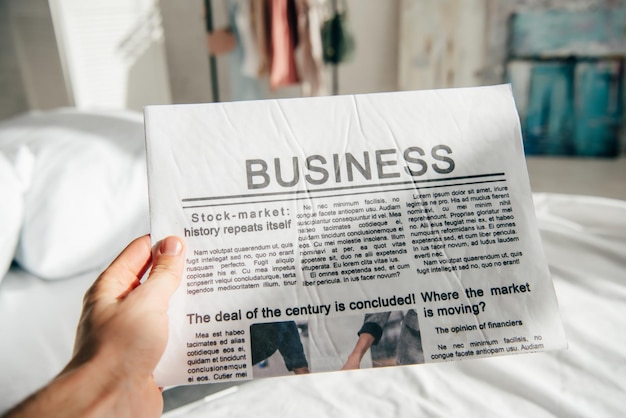 Premium Photo | Cropped view of man holding business newspaper Premium Photo | Cropped view of man holding business newspaper
