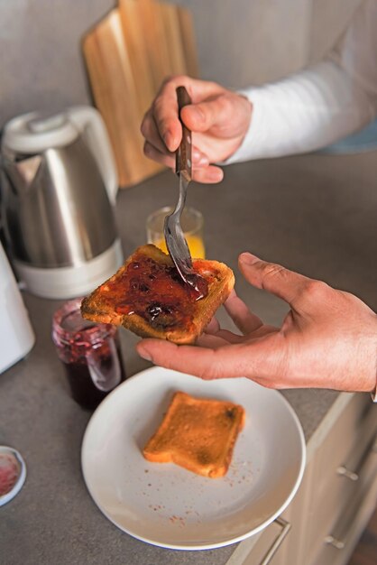 Cropped view man spreading jam | Premium AI-generated image Cropped view man spreading jam | Premium AI-generated image