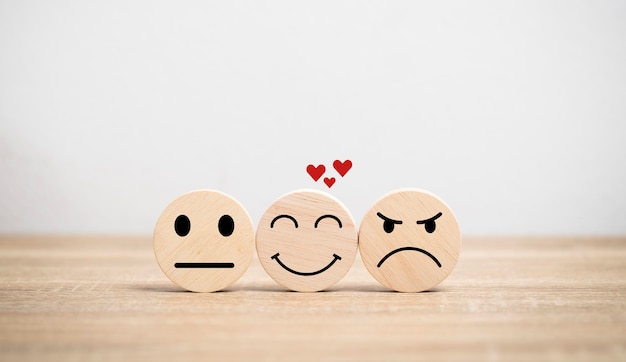 Premium Photo | Customer putting wood sphere smile face emoticon for ... Premium Photo | Customer putting wood sphere smile face emoticon for ...