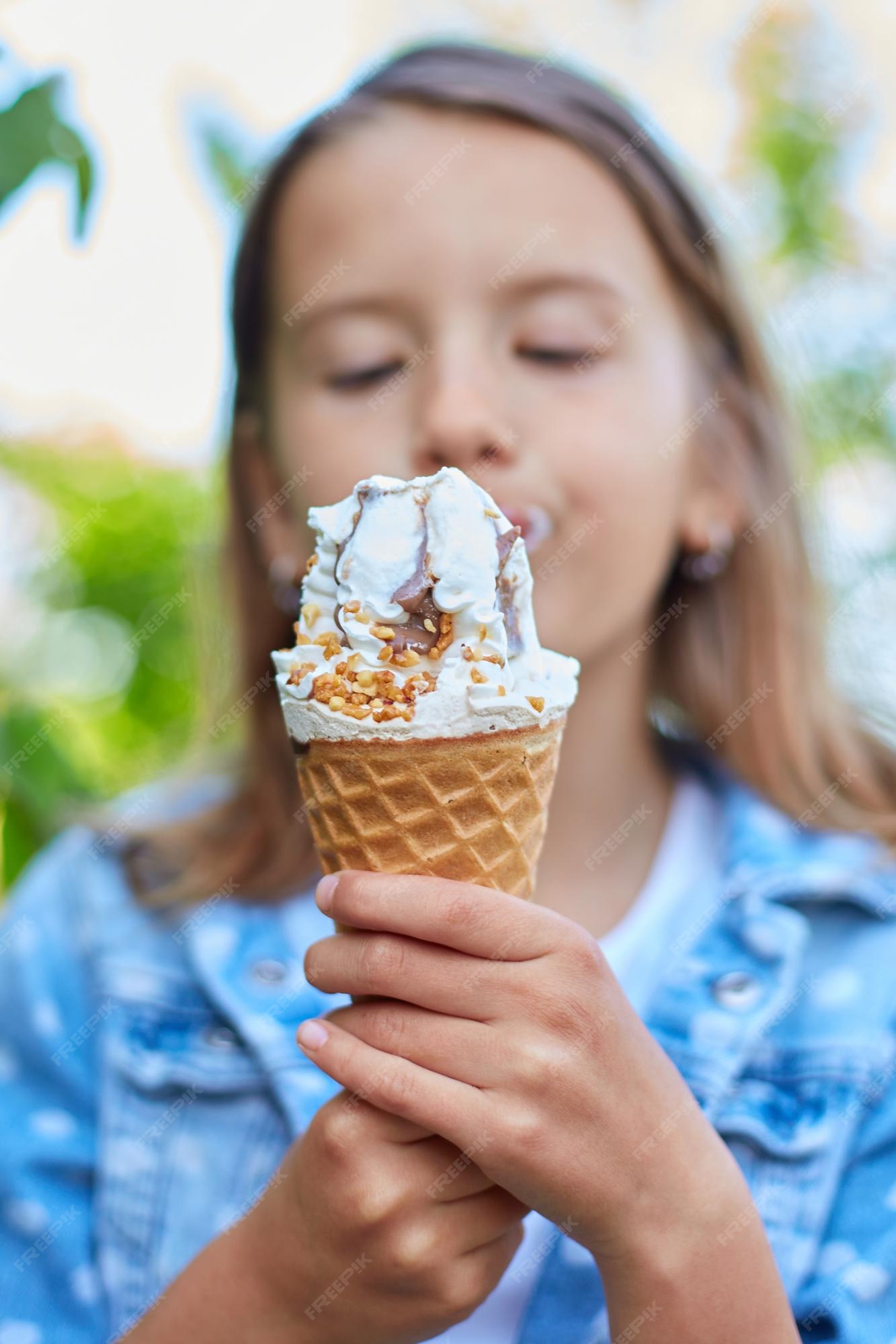 Premium Photo Cute Girl Liccking And Eating Italian Ice Cream Cone While Resting In Park On