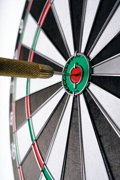 Premium Photo | Dart for playing darts hitting exactly center target Premium Photo | Dart for playing darts hitting exactly center target
