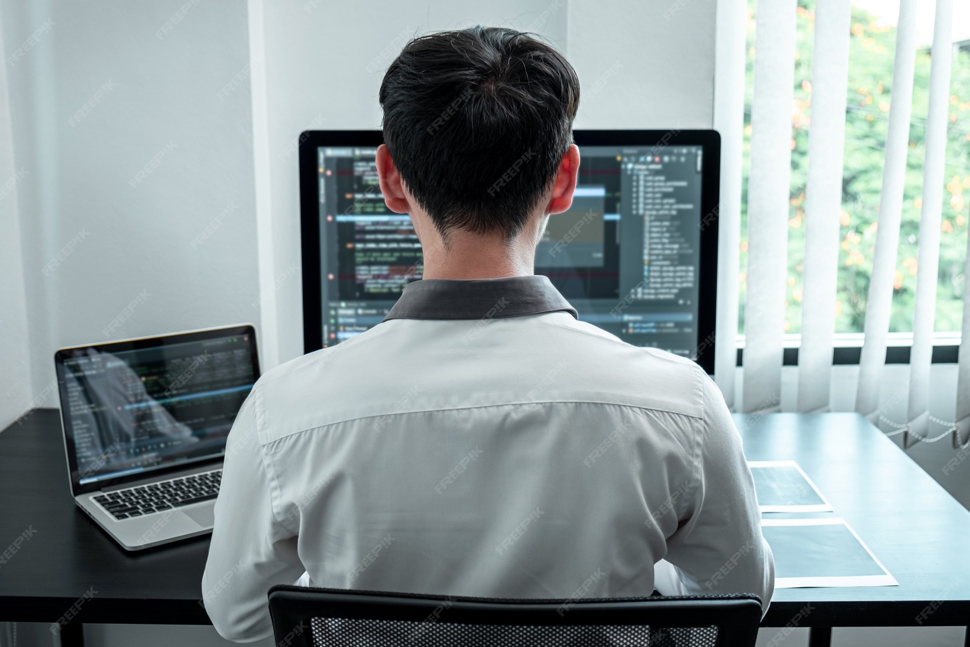 Premium Photo | Developer programmer working on coding program software computer in office