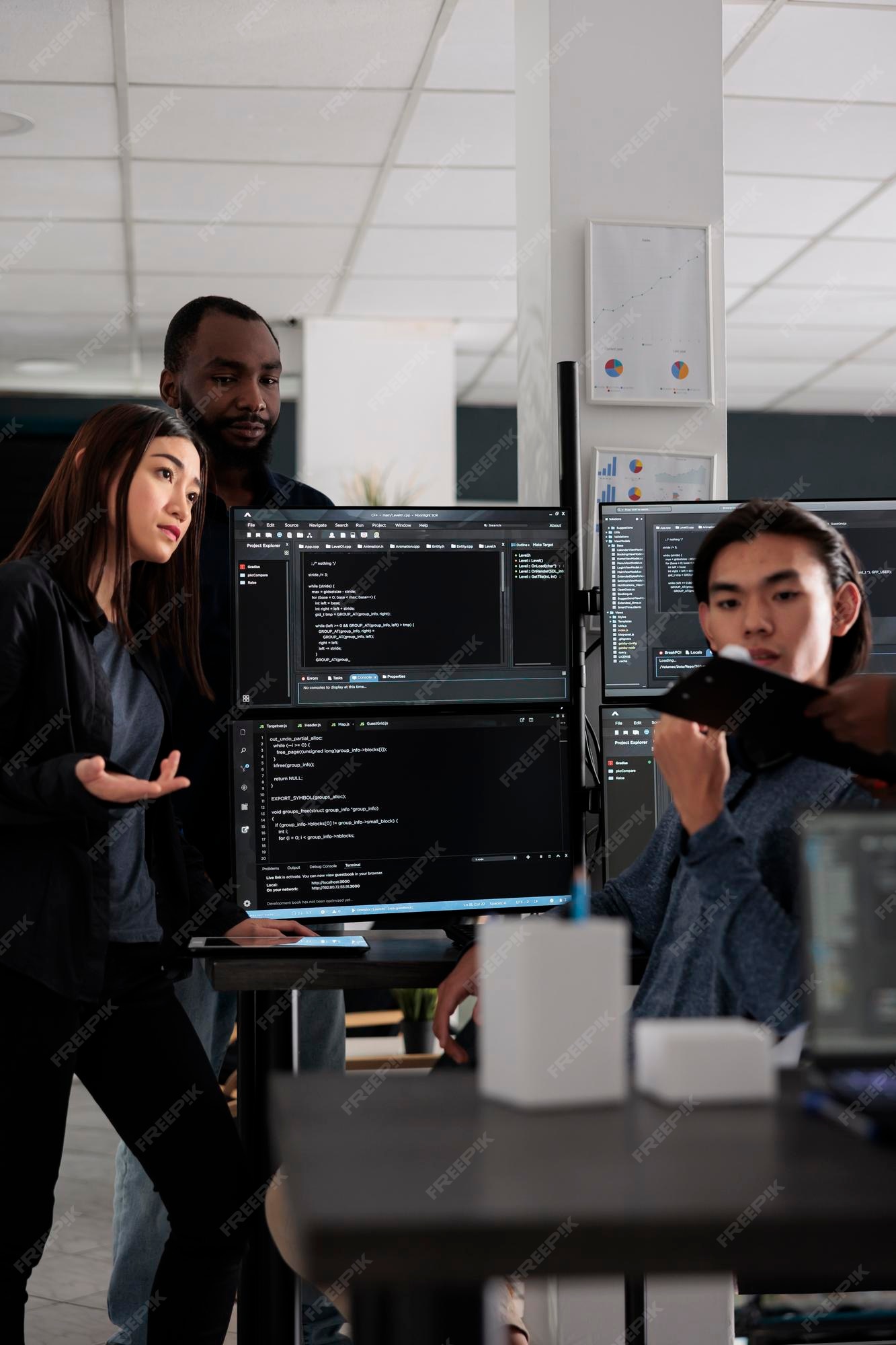 Premium Photo | Diverse database developers discussing about html code on terminal window ...