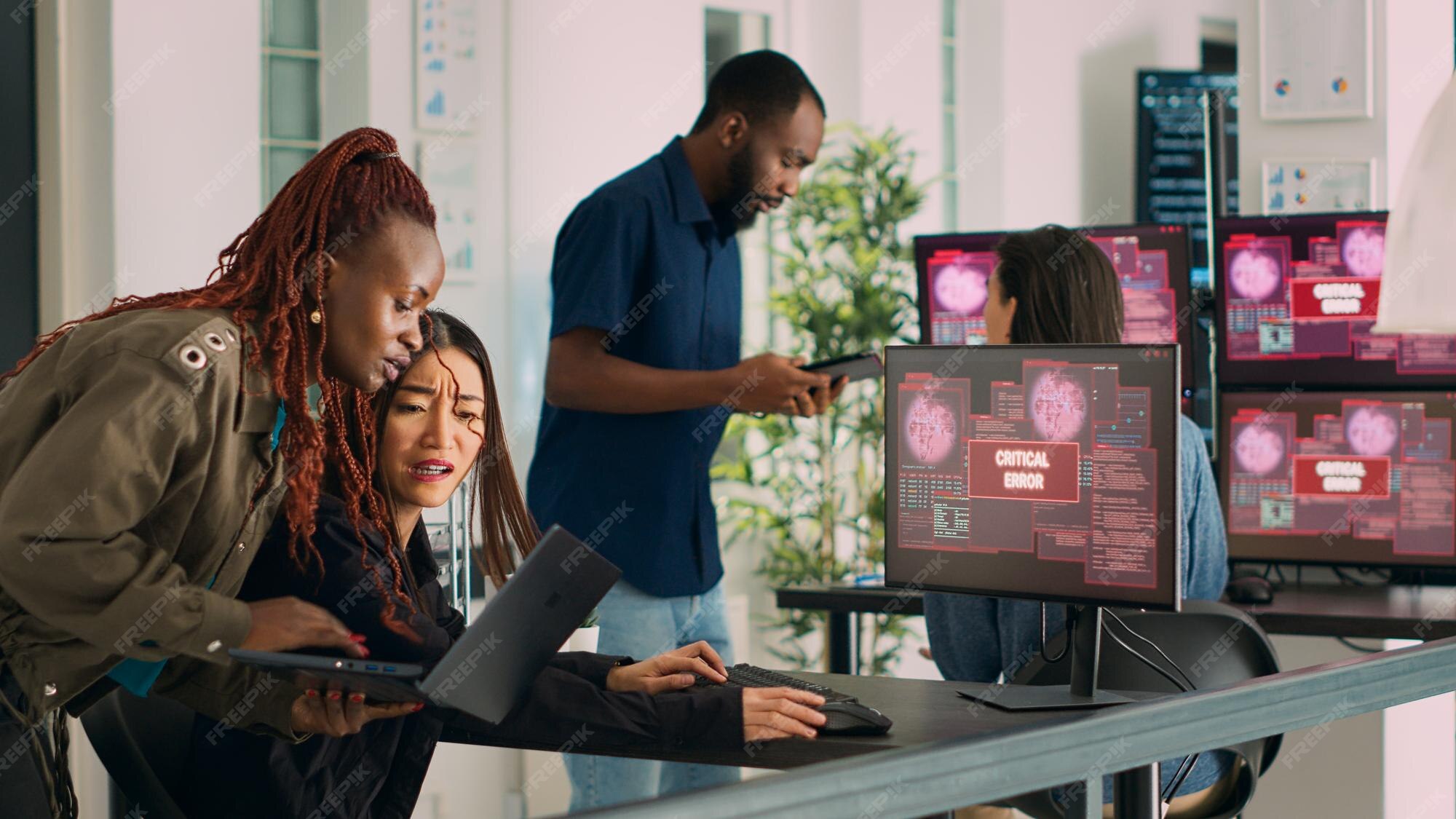 Premium Photo | Diverse group of engineers having computer hacked and ...