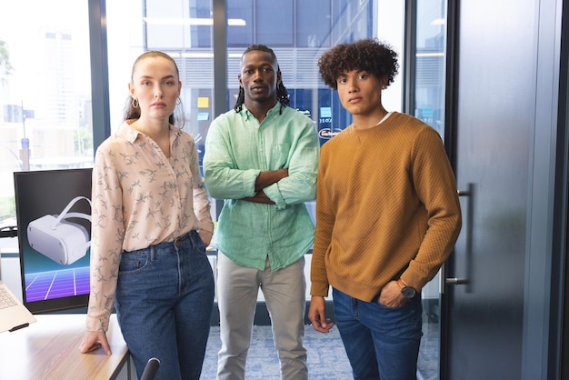 Premium Photo | Diverse team standing in office looking serious Premium Photo | Diverse team standing in office looking serious