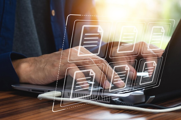 Premium Photo | Document management concept Businessman using computer ...