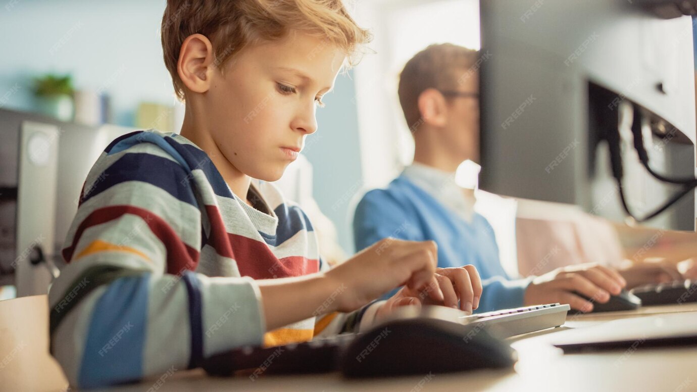 Elementary School Computer Science Classroom Smart Little Boy Uses ...