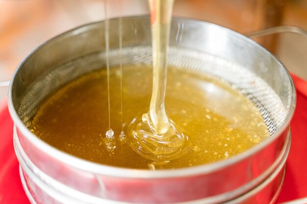 Premium Photo | Extraction of fresh honey Premium Photo | Extraction of fresh honey