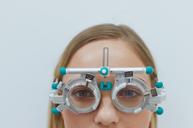 Premium Photo | Eyesight test woman in optometrist trial frame at studio Premium Photo | Eyesight test woman in optometrist trial frame at studio