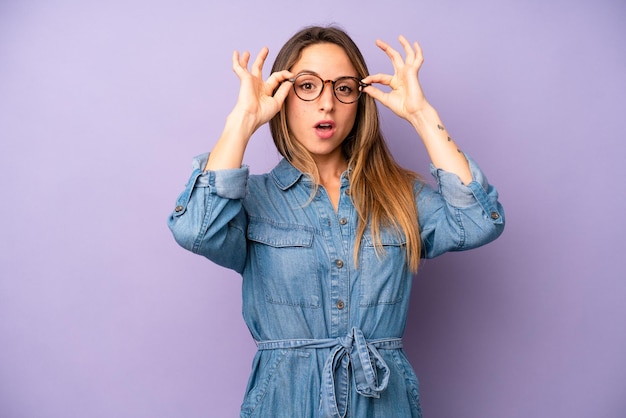 Premium Photo Feeling Shocked Amazed And Surprised Holding Glasses