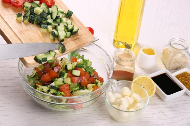 Premium Photo Female Hands Cutting Vegetables For Salad At Kitchen