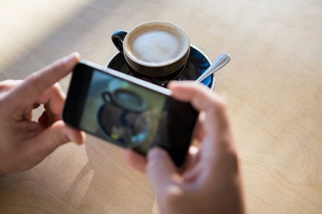 Premium Photo | Female hands photographing a coffee cup Premium Photo | Female hands photographing a coffee cup