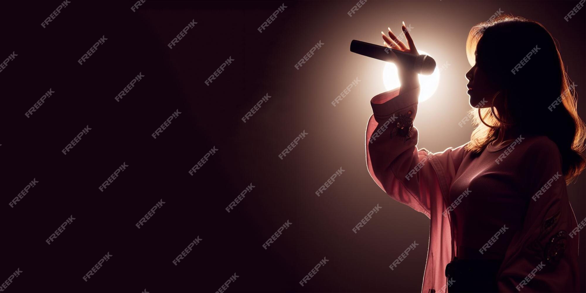 Premium Photo Female Singer Holding Microphone Singing In Pink Dark