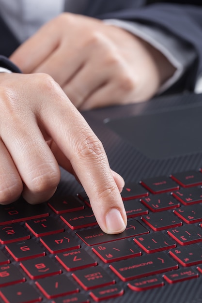 Premium Photo | Finger pushing enter button on laptop keyboard Premium Photo | Finger pushing enter button on laptop keyboard