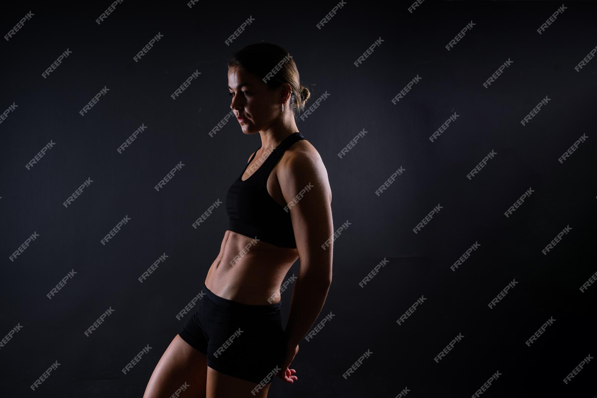 Premium Photo Fitness Woman Showing Abs And Flat Belly Isolated