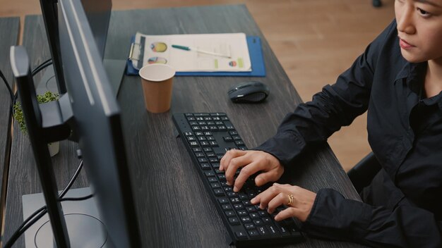Premium Photo | Focus on programer hands typing code on keyboard while looking at computer ...