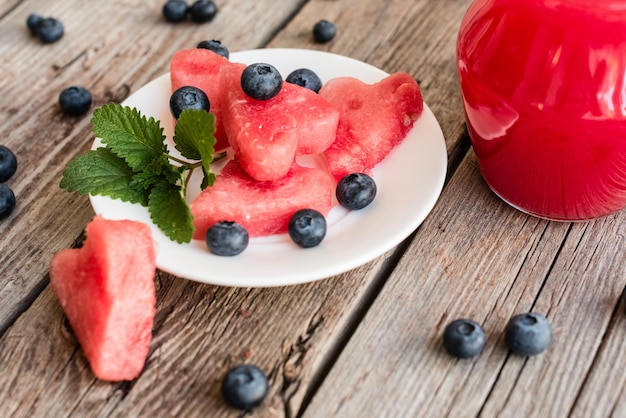 Premium Photo | Fresh sliced watermelon on a wooden background Premium Photo | Fresh sliced watermelon on a wooden background