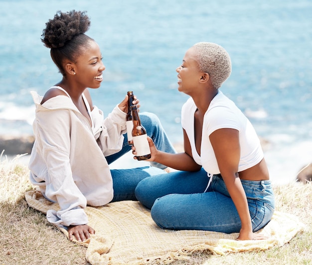 Premium Photo Friends Drinking A Beer On The Beach While Talking And