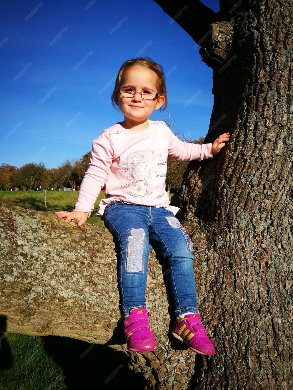 Premium Photo Full Length Portrait Of Girl Sitting On Tree During