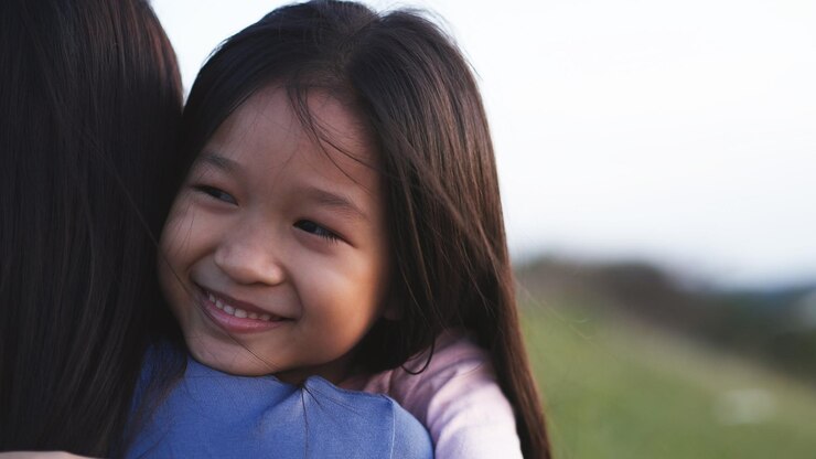Premium Photo A Girl Hugging Her Mother
