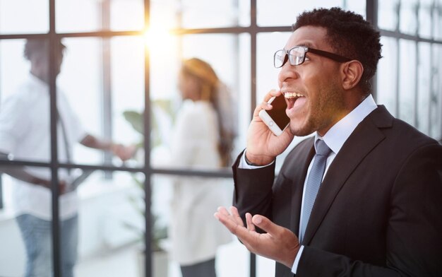 Premium Photo | Good connection Young african guy talking by cell phone ... Premium Photo | Good connection Young african guy talking by cell phone ...