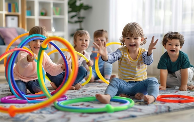 Group of joyful children playing with colorful hula hoops indoors ... Group of joyful children playing with colorful hula hoops indoors ...