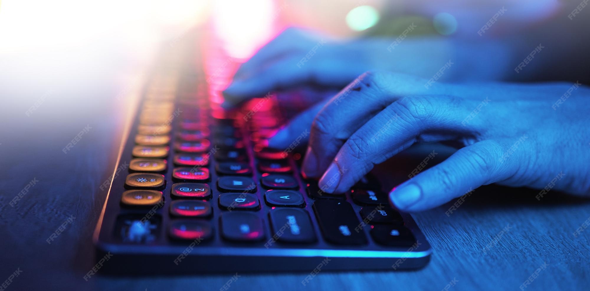 Premium Photo Hacker Hands And Typing On Neon Keyboard For Software