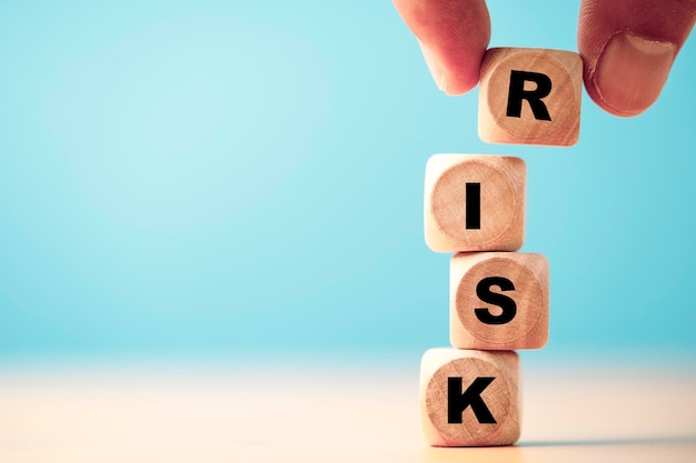 Premium Photo | Hand putting risk wording print screen on wooden block ... Premium Photo | Hand putting risk wording print screen on wooden block ...