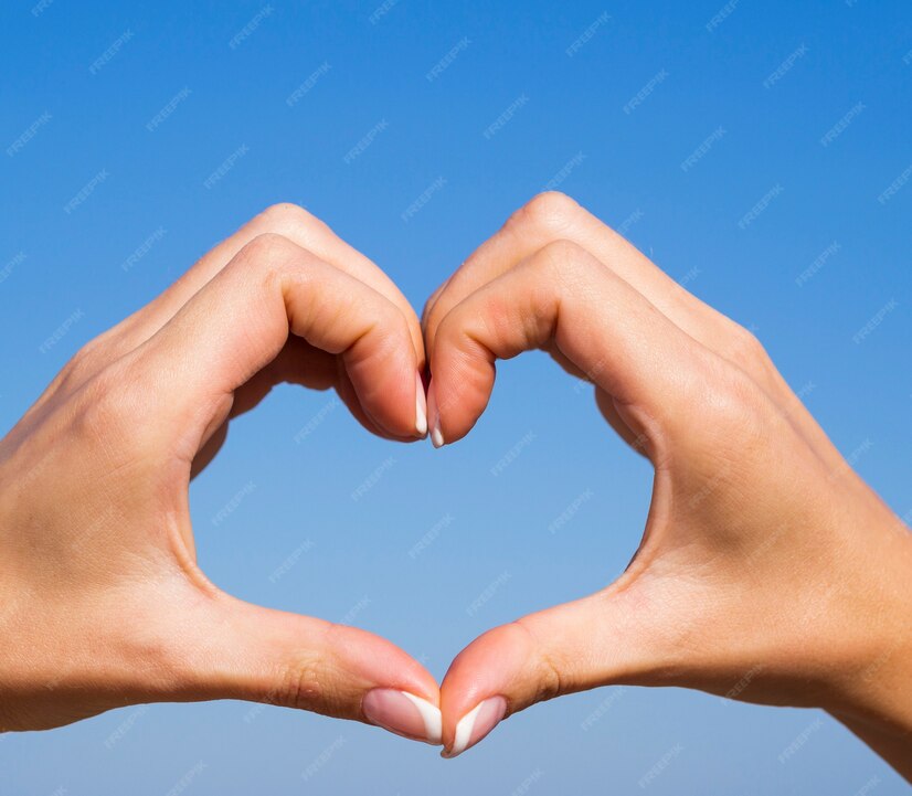 Premium Photo | Hands creating a heart shape in the sky Premium Photo | Hands creating a heart shape in the sky