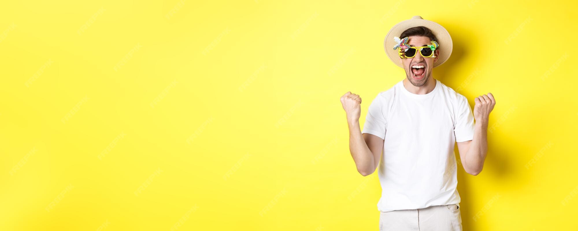 Premium Photo Happy Guy Going On Vacation Winning Or Celebrating Wearing Summer Hat And
