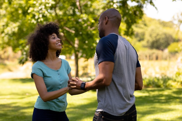 Premium Photo Happy Young Couple Holding Each Other In The Garden