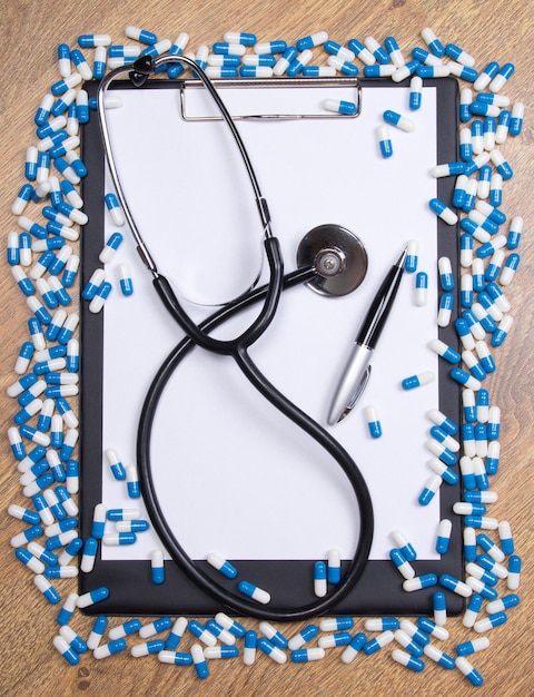 Premium Photo Heal Of Tablets Clipboard Stethoscope And Pen On Wooden