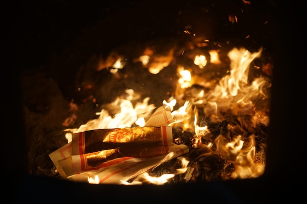 Premium Photo | High angle view of joss papers burning in fire Premium Photo | High angle view of joss papers burning in fire